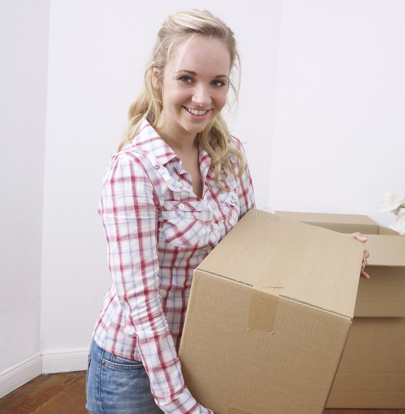 Young woman carrying box stock photo. Image of delivers - 11738348