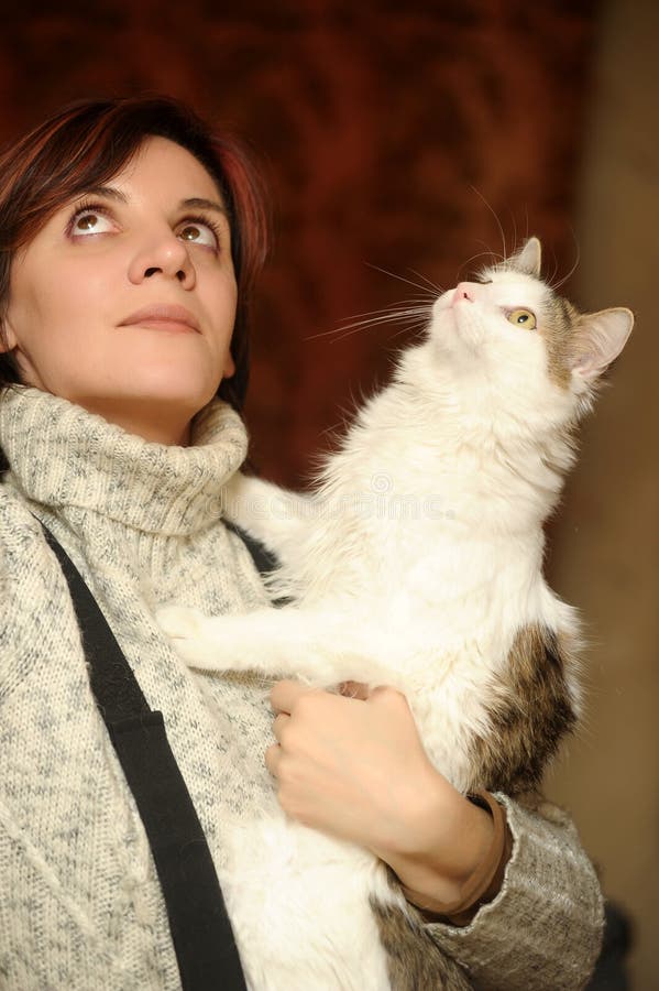 Young woman with a cat stock photo. Image of hold, girl - 27329610