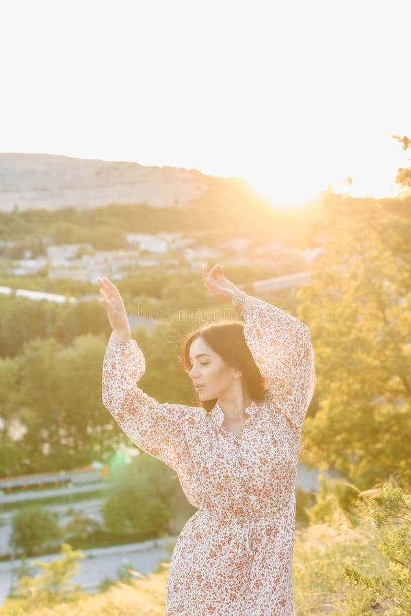 The Young Woman is Catching the Sun Rays. the Young Woman is on the ...