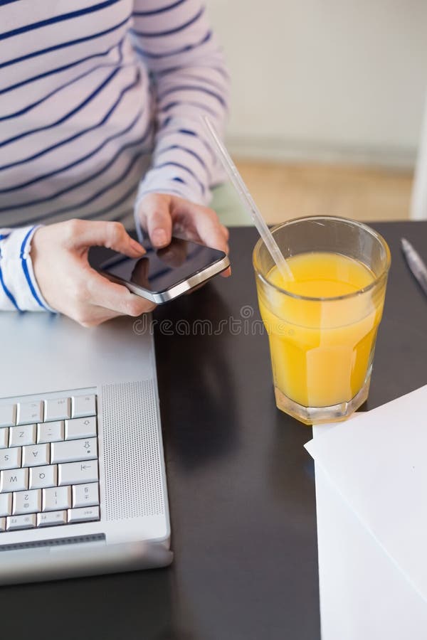 Young Woman Catching Up on Work Stock Image - Image of coffee, person ...