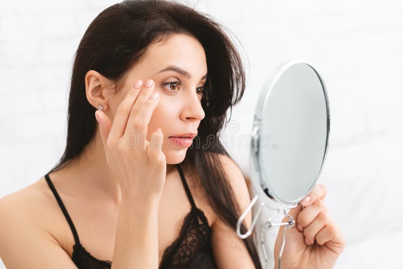 Young Woman Checking Her Wrinkles with Mirror Stock Image - Image of ...
