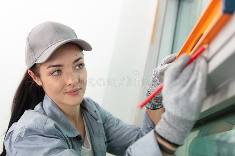 Young Woman Checking Window with Spirit Level Stock Image - Image of ...
