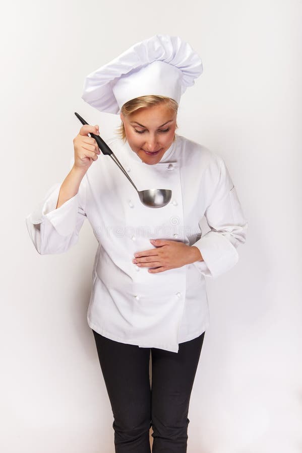 Young Woman Chef Holding Spoon, Smiling. Testing Stock Photo - Image of ...