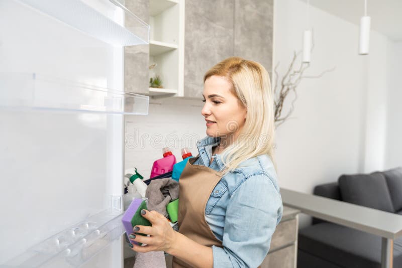 Young Woman Cleaning Empty Fridge with a Sponge Stock Image - Image of ...