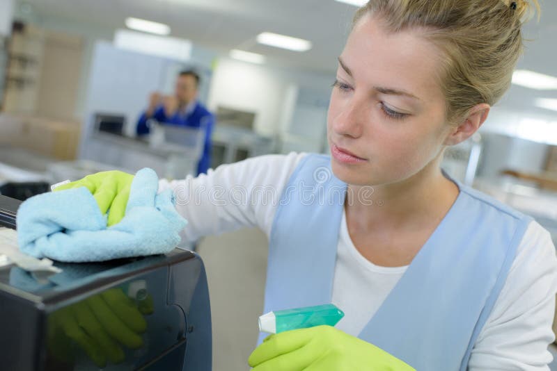 Young Woman Cleaning Office Table Stock Photo - Image of hygiene ...