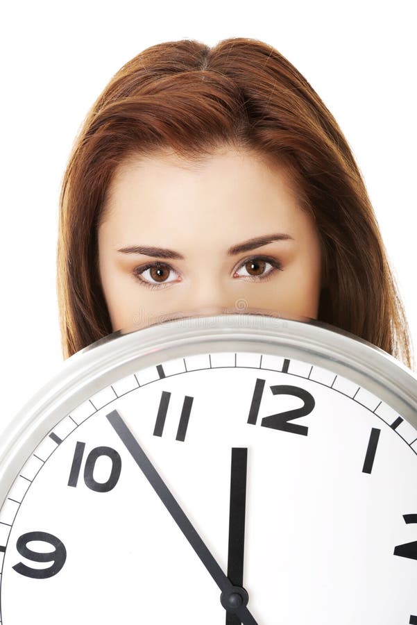 Young woman with clock stock photo. Image of background - 45440046