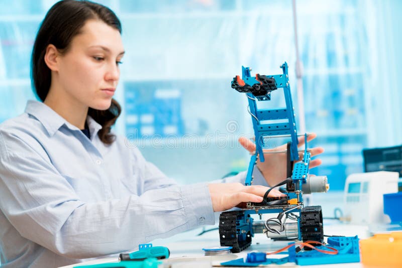 Student Woman in Robotics Laboratory Working on Project Mechatronics ...