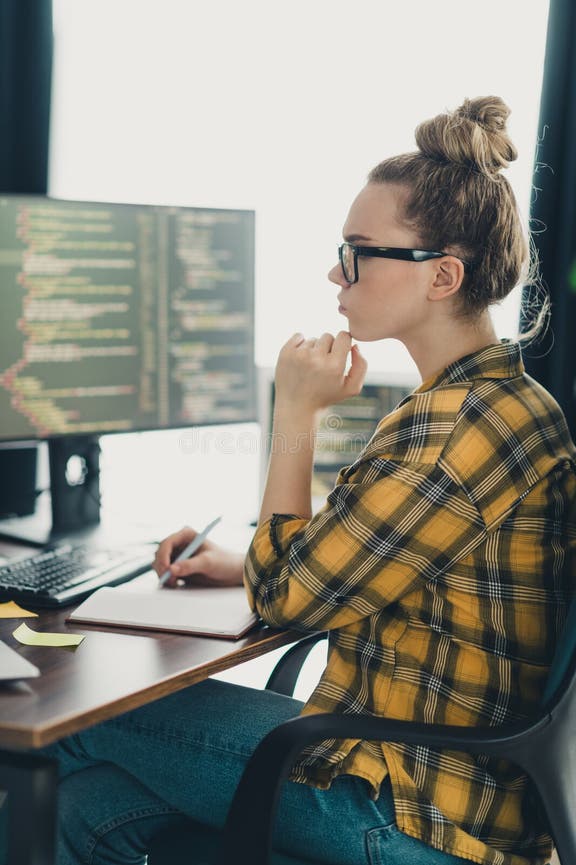 Confident Female Programmer Coding on a Computer, Working Remotely in a ...