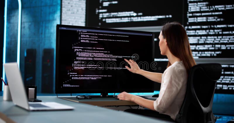 Young woman coding at desk stock image. Image of software - 361515759