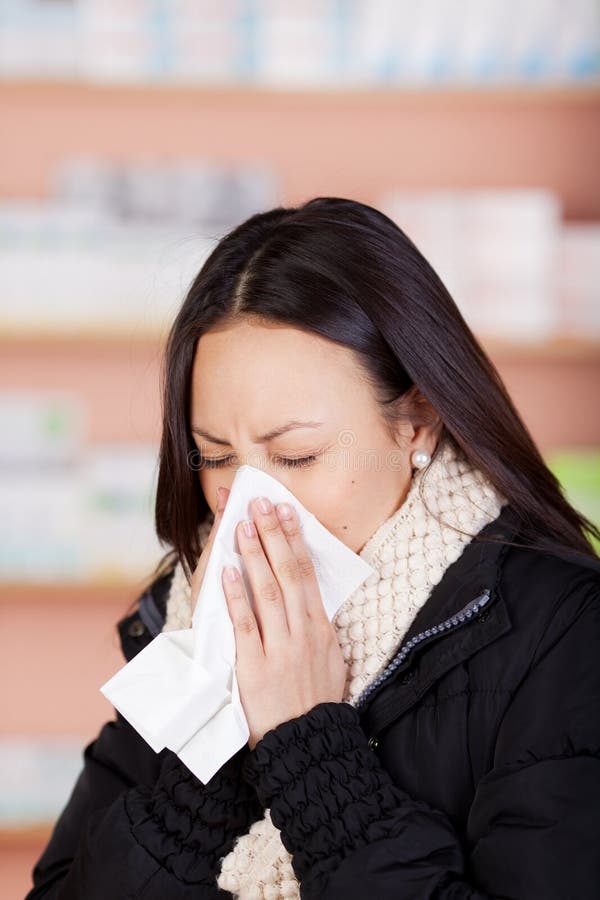 Young Woman Using Tissue in Pharmacy Stock Image - Image of pharmacy ...
