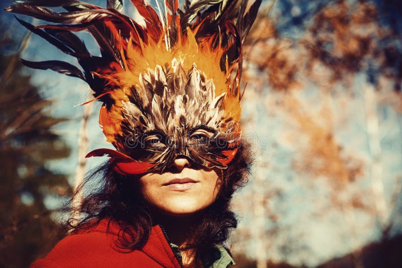 Young Woman with a Colorful Feather Face Mask. Stock Photo - Image of ...