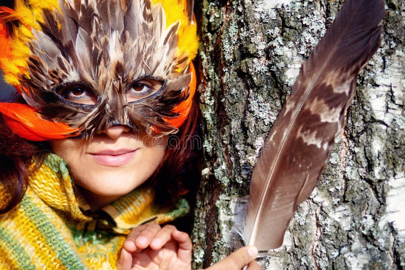 Young Woman with a Colorful Feather Face Mask. Stock Photo - Image of ...