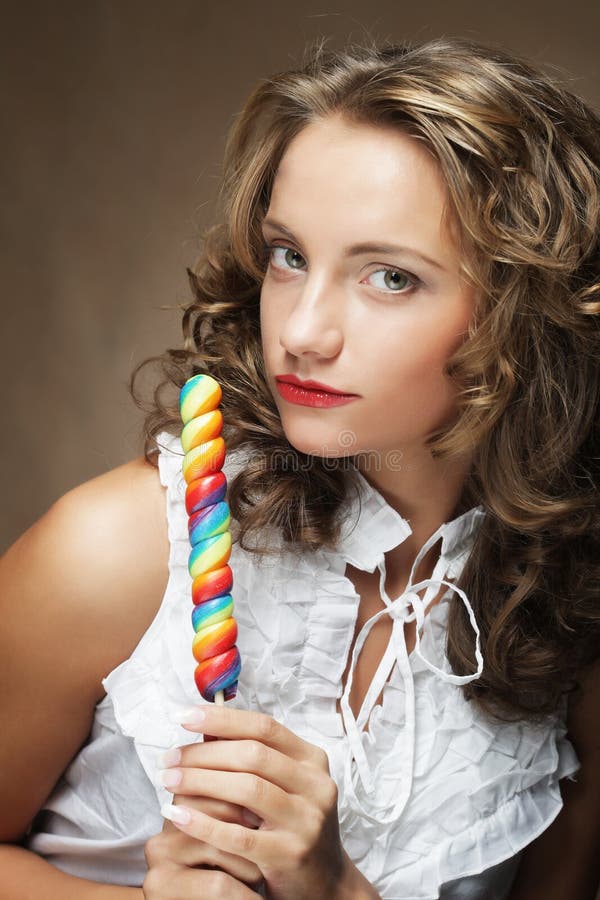 Young Woman with Colorful Lollipop Stock Image - Image of coquette ...