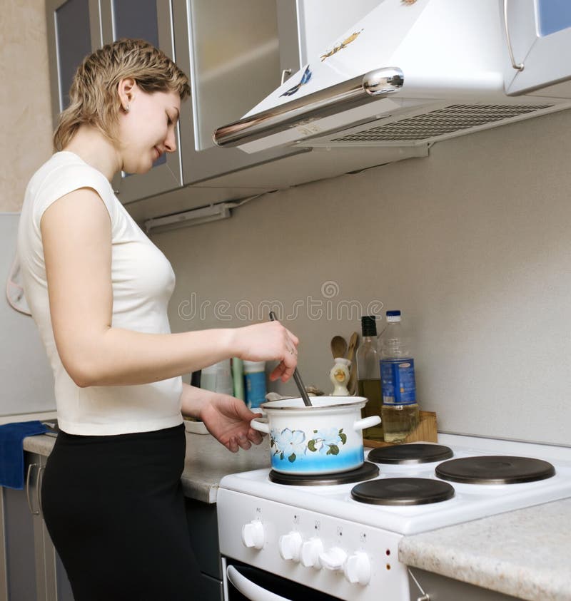 Young woman cooking stock image. Image of food, wife, kitchen - 4852449