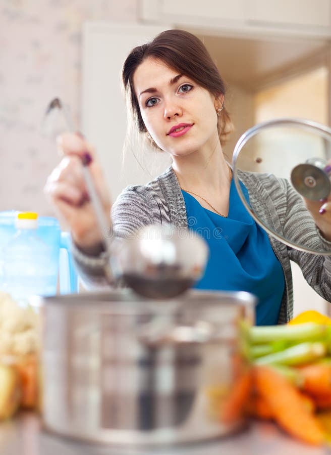 Young Woman Cooking Soup with Laddle Stock Photo - Image of sauce, read ...