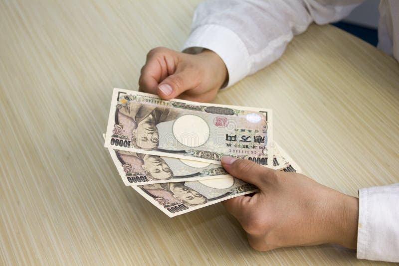 Young Woman Counting Japanese Yen Stock Image - Image of holding, money ...