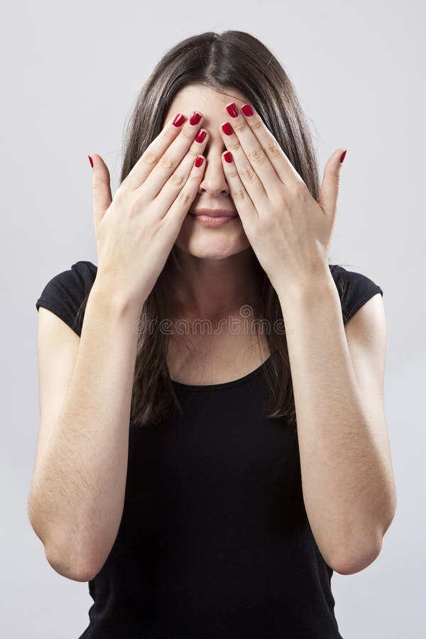 Young woman covering eyes stock image. Image of pretty - 16652043