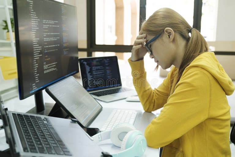 Young Woman Covering Her Face with the Stress of Work Coding and ...