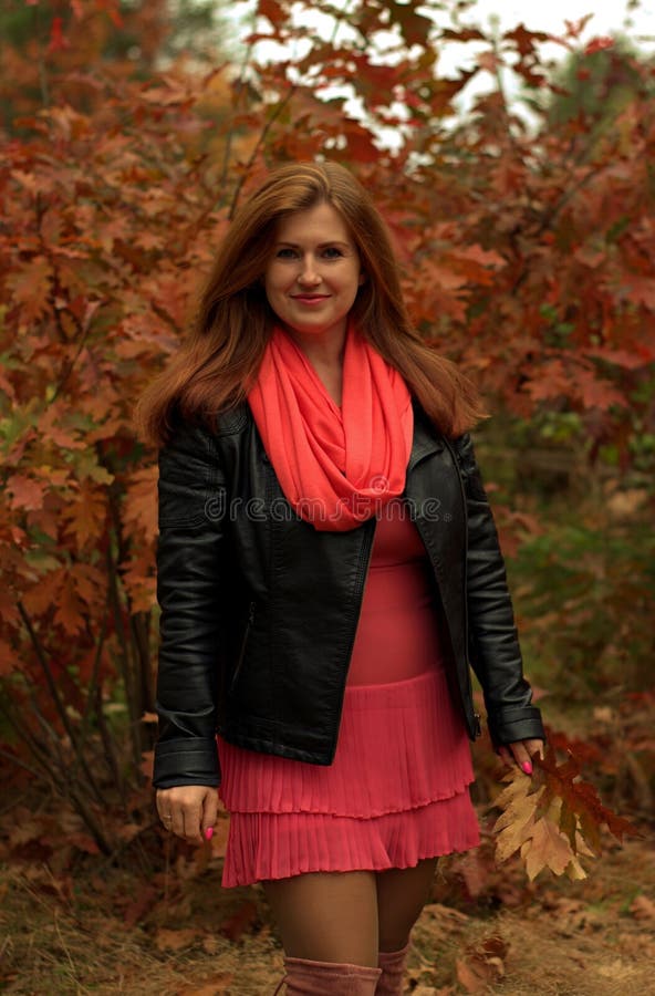 A Young Woman with Curves Poses in the Park. Stock Image - Image of ...