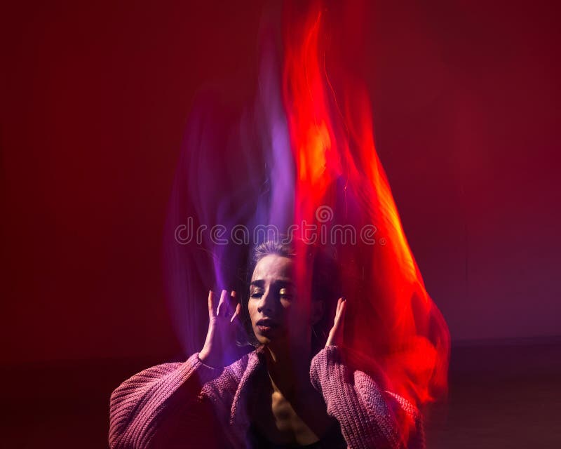 Young Woman Dancing Modern Dances in Red Blue Neon Light. Stock Photo ...