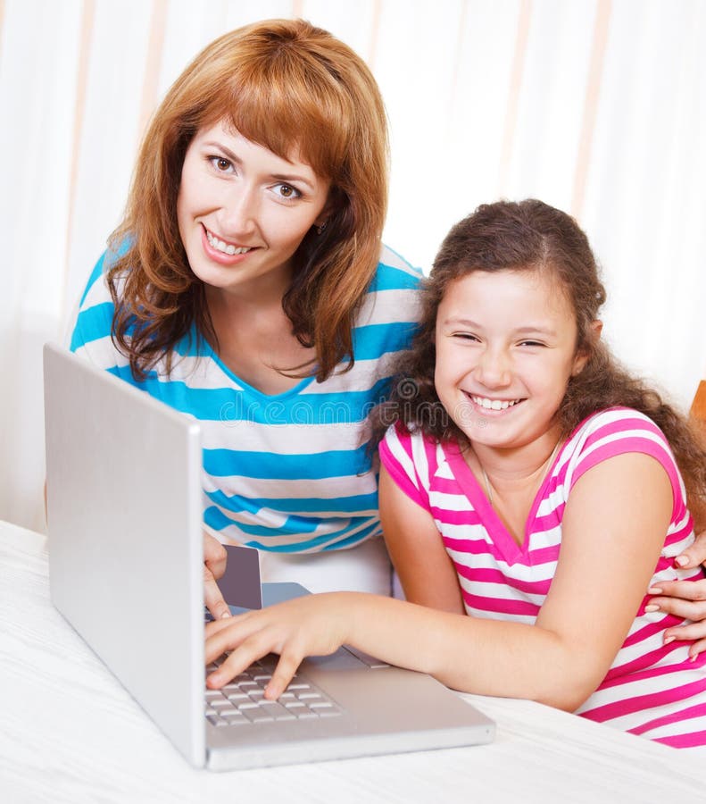 Young Woman with Daughter Using Laptop Computer Stock Photo - Image of ...