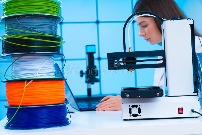 Young Woman in Design Office with 3d Printer and Plastic Filament ...