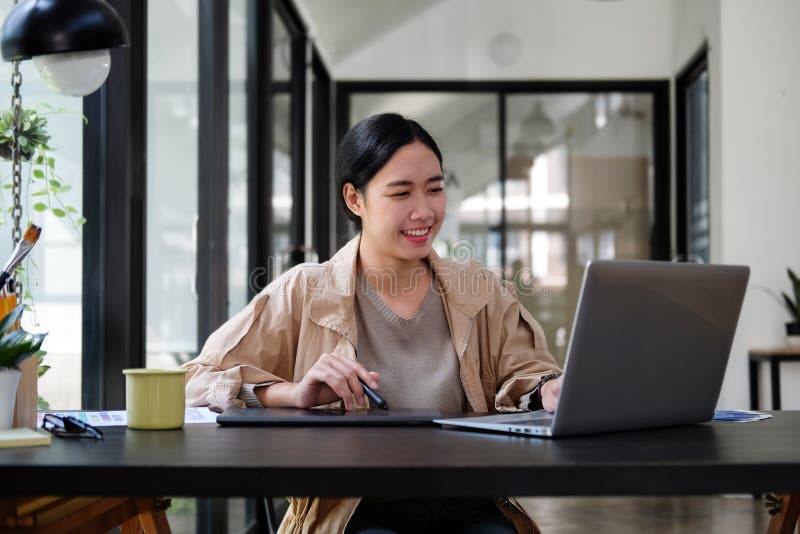 Young Woman Designer Working with Computer Laptop in Creative Office ...