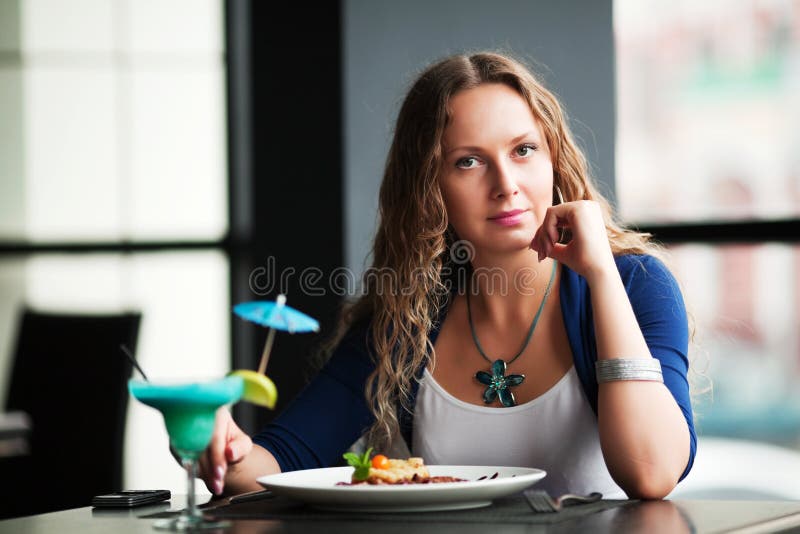 Young woman dining. stock photo. Image of looking, beautiful - 16166694
