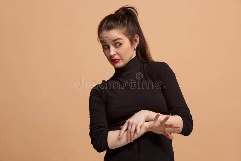 Young Woman With Disgusted Expression Repulsing Something On The