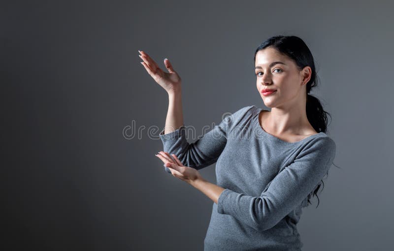 Young Woman with Displaying Hand Gesture Stock Photo - Image of hand ...