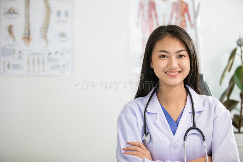 Young Woman Doctor Smiling and Working at Office Stock Image - Image of ...