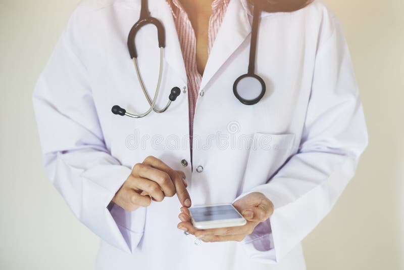 Young Woman Doctor Using the Mobile Phone Stock Photo - Image of ...