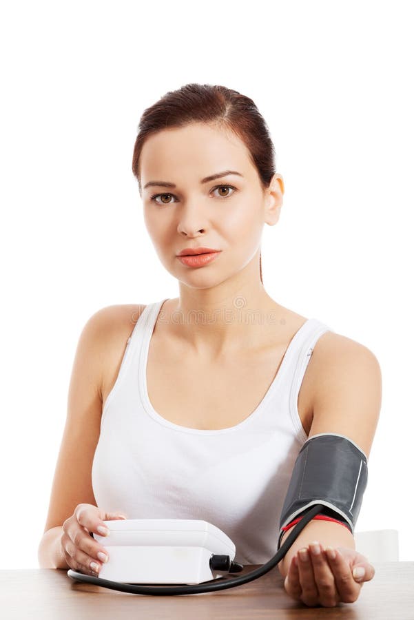Young Woman Doing Blood Pressure Test. Stock Image - Image of medicine ...