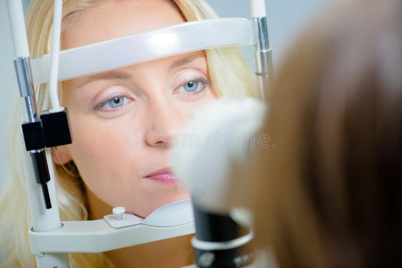 Young woman doing eye test stock photo. Image of optical - 153022078
