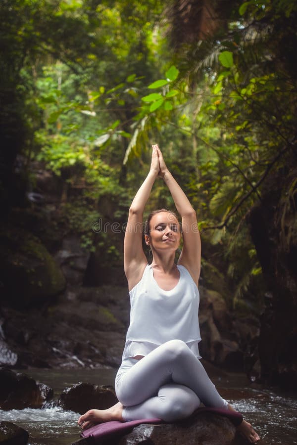 Yoga on the waterfall stock photo. Image of gymnastics - 101944208