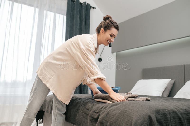 A Young Woman Doing Housework and Looking Busy Stock Photo - Image of ...