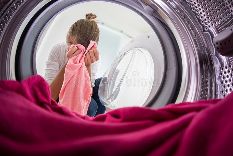 Young woman doing laundry stock photo. Image of duties - 92584960