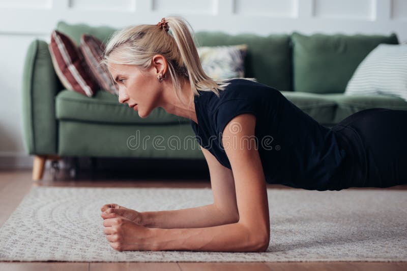 Young Woman Doing Plank Exercise at Home. Stock Photo - Image of woman ...