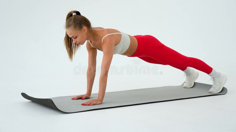 Young Woman Doing Plank Exercise on White Background. Stock Footage ...