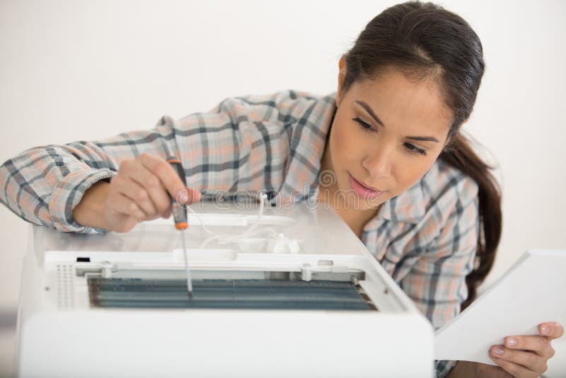 Young Woman Doing Printer Maintenance Stock Photo - Image of ...
