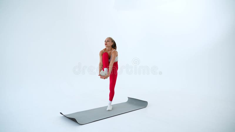 Young Woman Doing Splits Exercise on White Background. Stock Footage ...