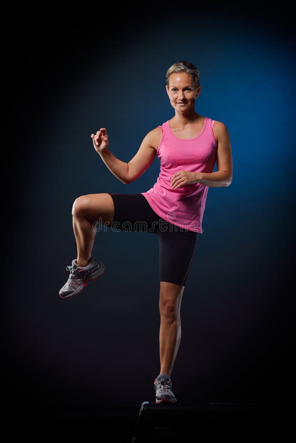 Young Woman Doing Step Exercises Stock Image - Image of body, energy ...