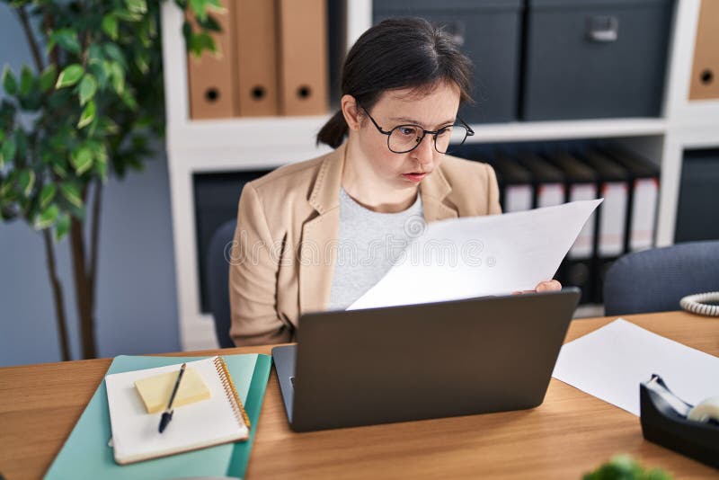 Young Woman with Down Syndrome Business Worker Reading Document Working ...