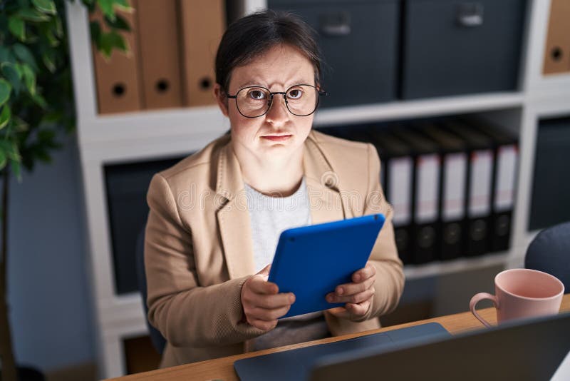 Young Woman with Down Syndrome Business Worker Using Touchpad Working ...