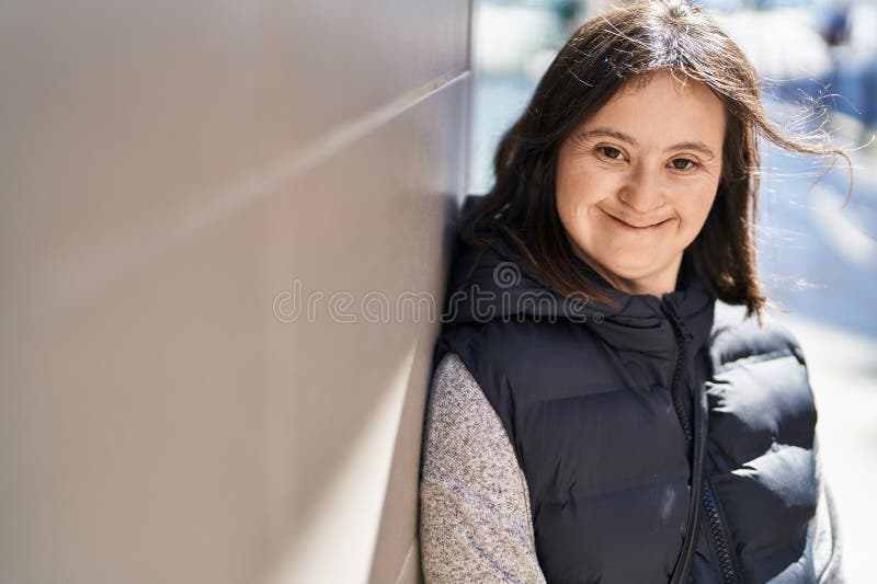 Young Woman With Down Syndrome Smiling Confident Standing At Street