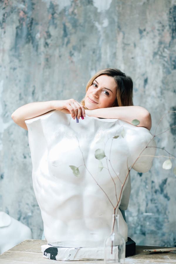 Young Woman Draws in a Light Studio Stock Photo - Image of paints ...
