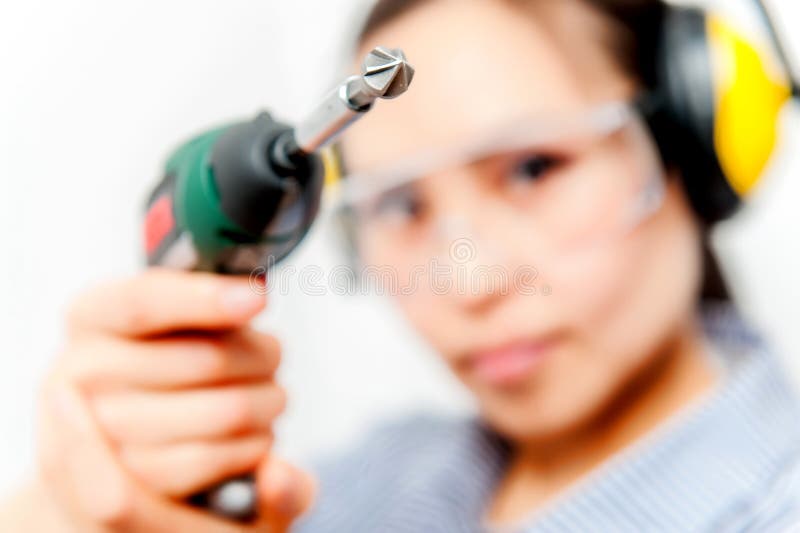 Young woman with a drill stock photo. Image of glasses - 65489720