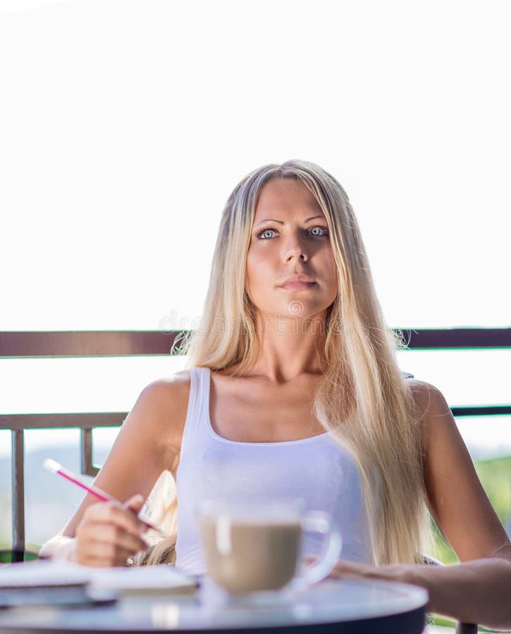 Young Woman Drink Coffee and Writing in Note Book Journal in Cafe Stock ...