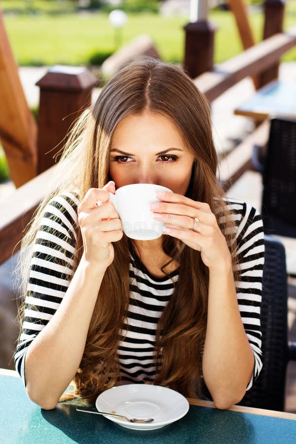 Young Woman Drinking Coffee in a Cafe Outdoors Stock Image - Image of ...