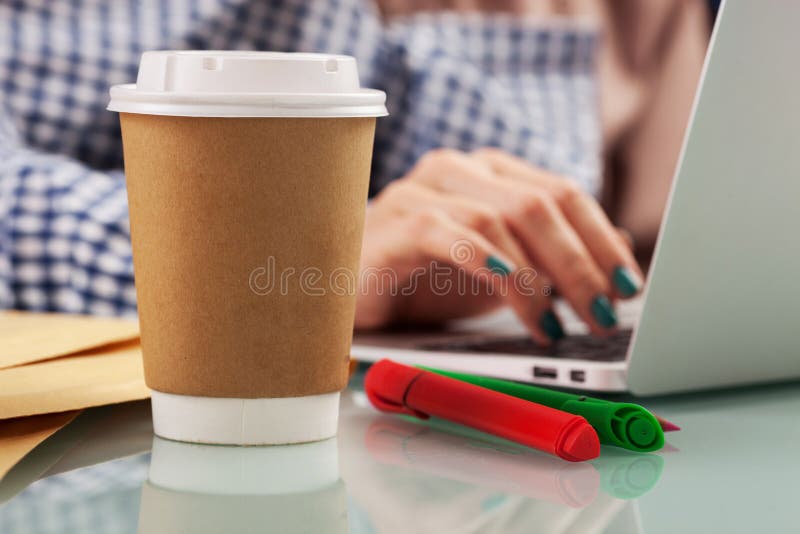 Young Woman Drinking Coffee from Disposable Cup at the Office while ...